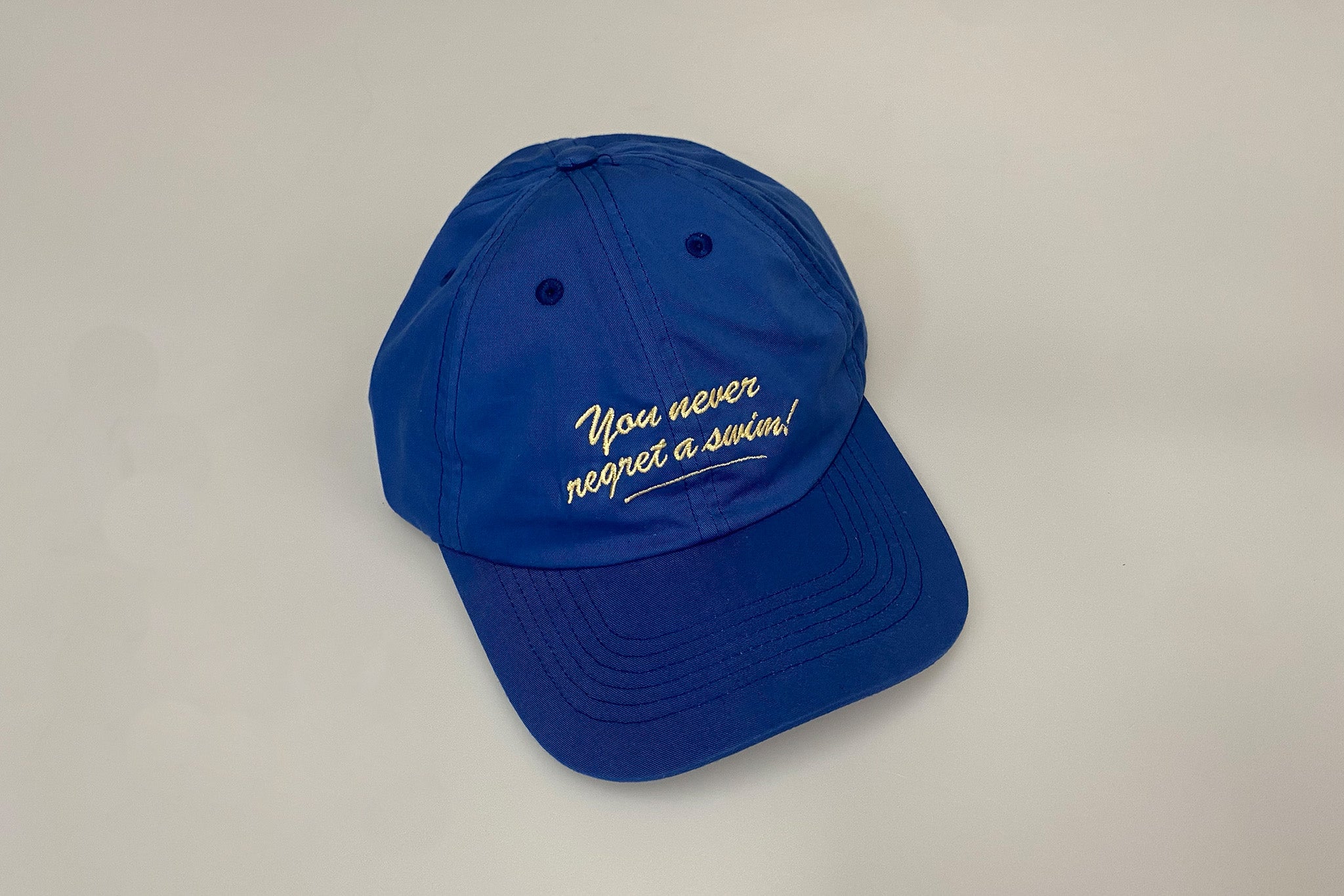 'You Never Regret a Swim' Cap - Blue – Camp Cove Swim
